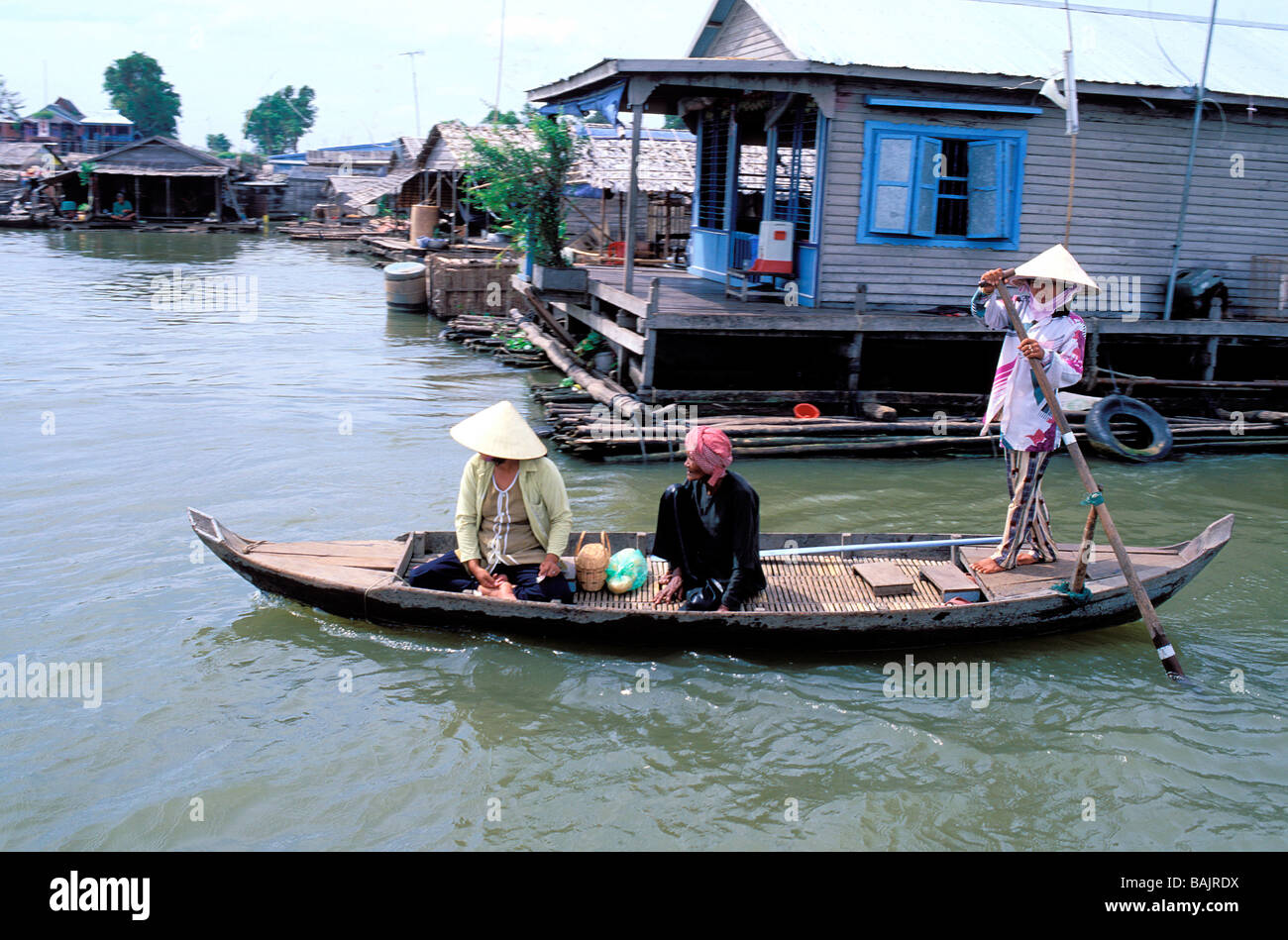Cambodia, Kompong Chhnang lake village in Tonle Sap Lake, dugout and ...