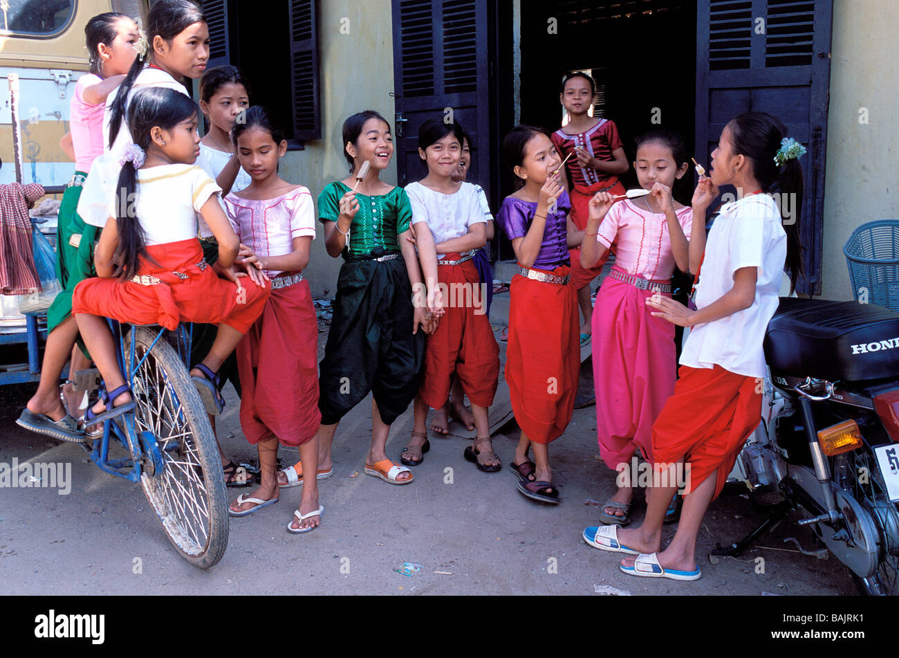 Cambodia, Phnom Penh, street scene, group of little girls in ...