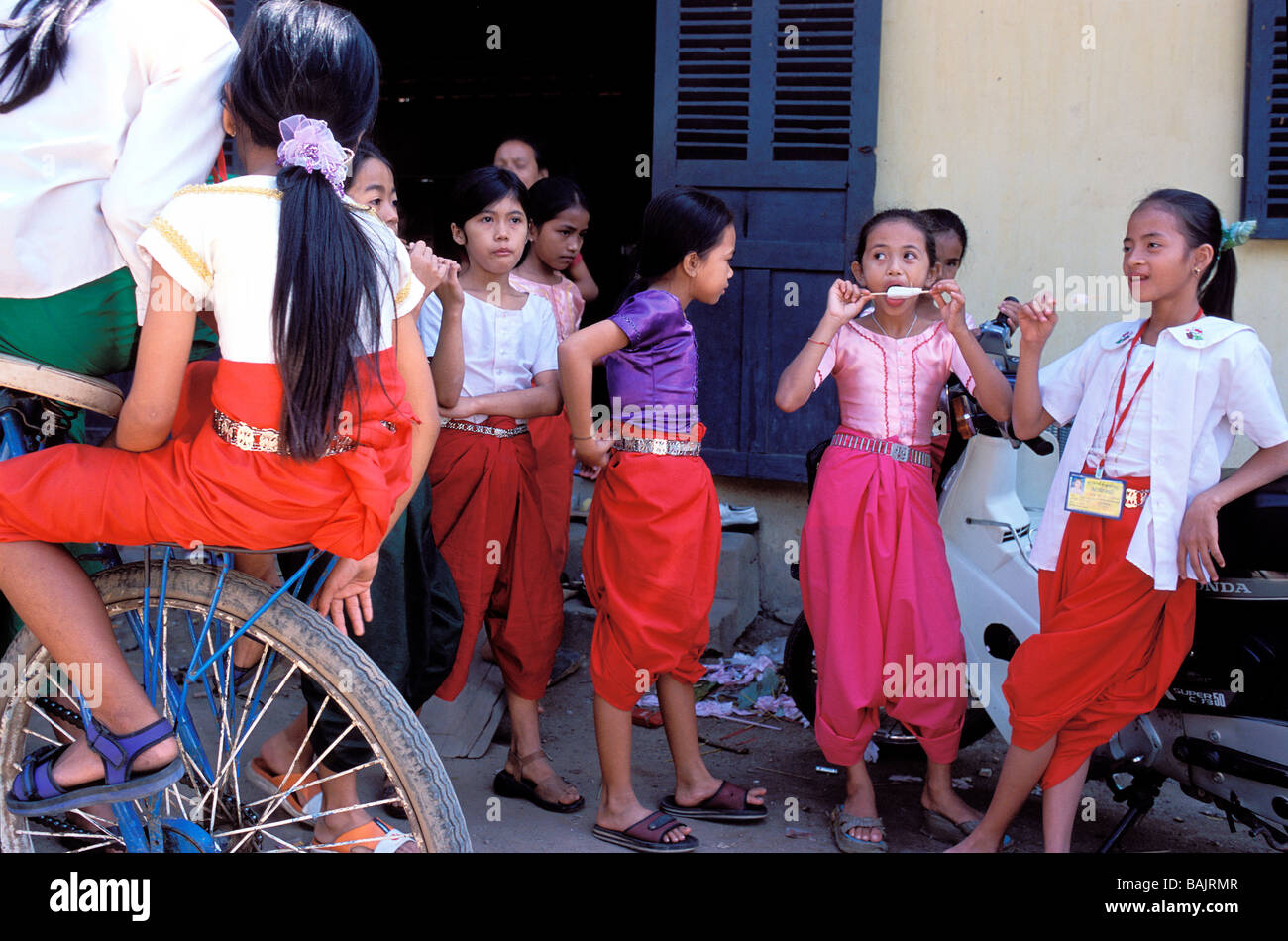 Cambodia, Phnom Penh, street scene, group of little girls in ...