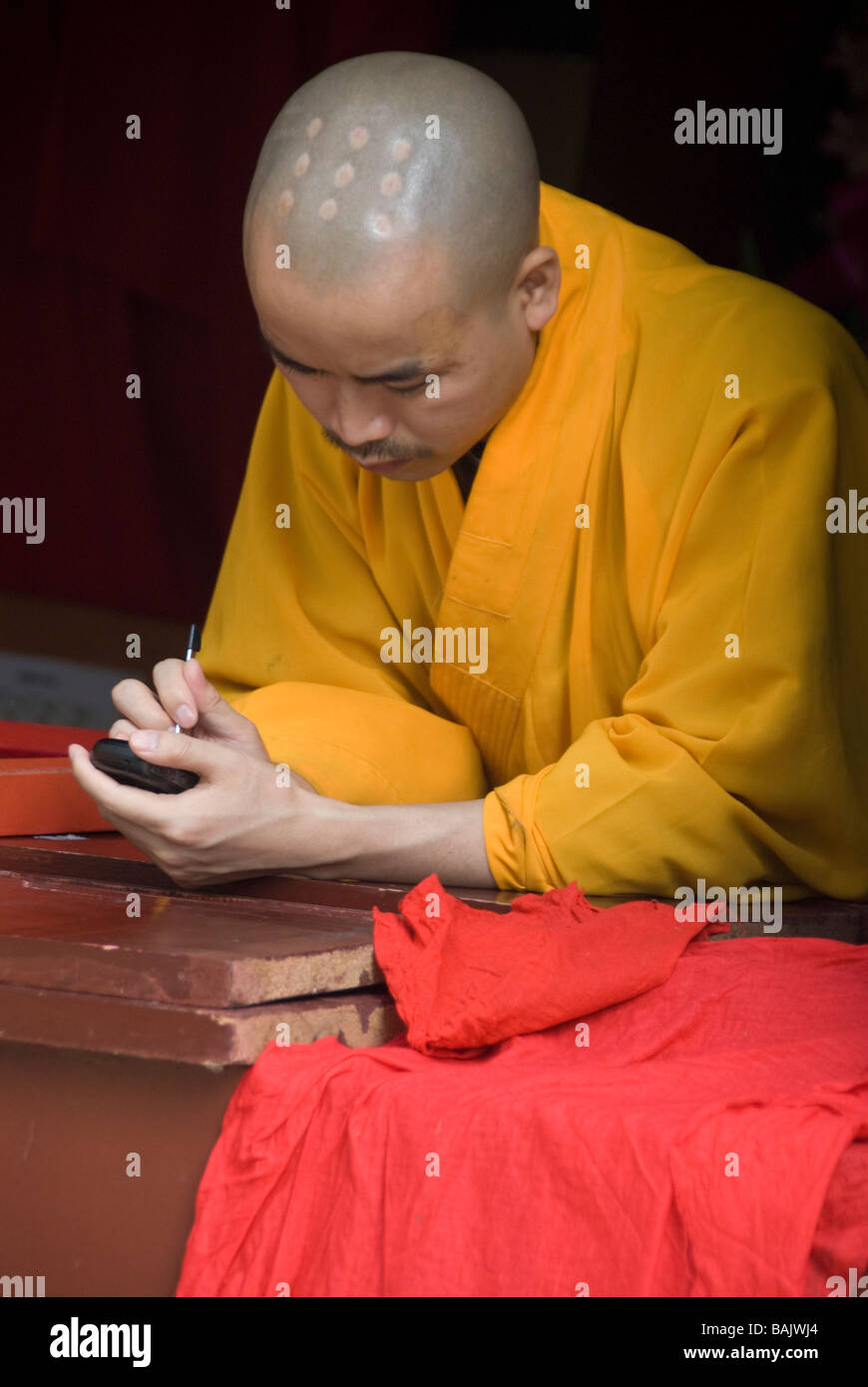 Monks cell phone hi-res stock photography and images - Alamy