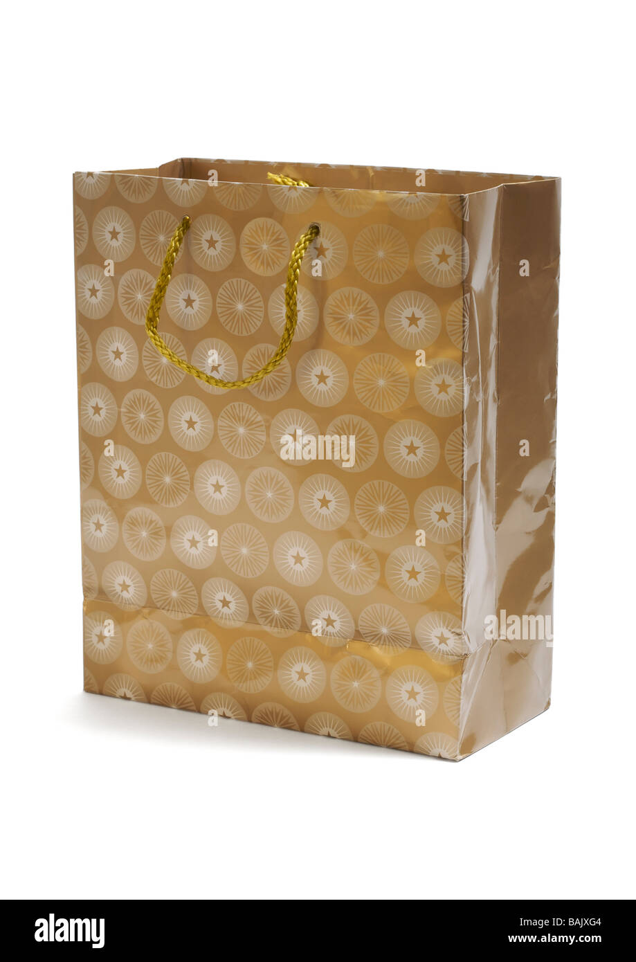 Gold paper gift bag on white background Stock Photo - Alamy