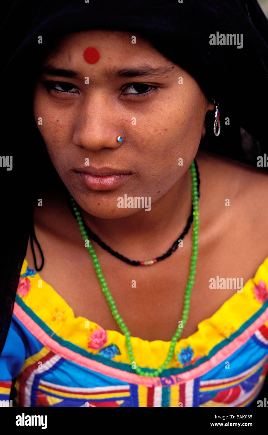 Nepal, Terai Region (Madhesh), portrait of young woman from Rana Tharu ...
