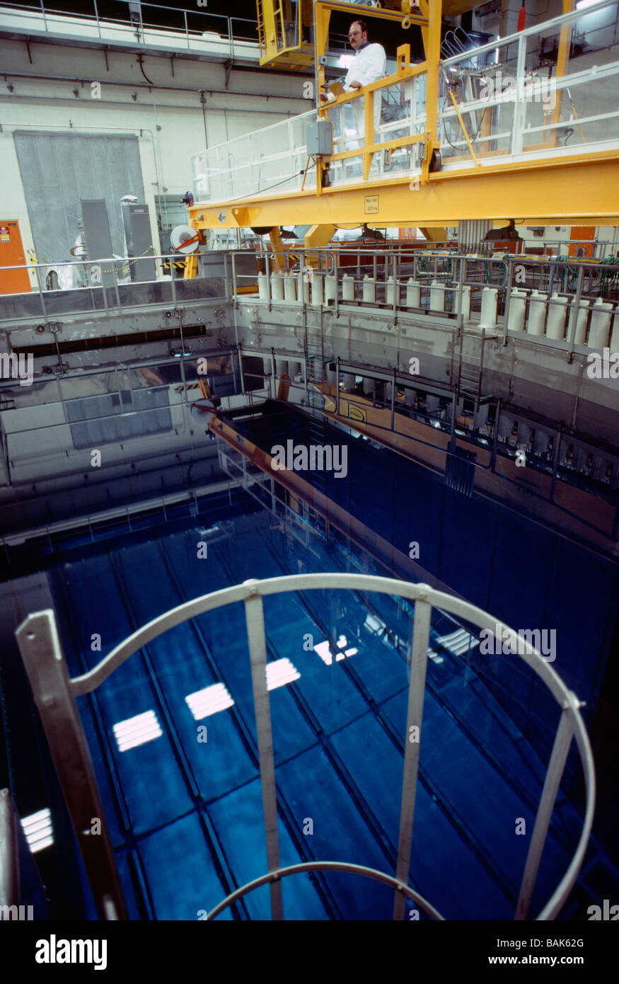 TECHNICIAN LOOKING DOWN ON ACTIVE REACTOR VESSEL THRU COOLING WATER ...