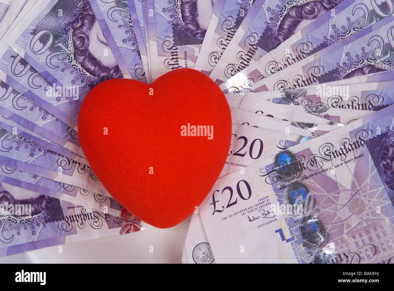 Money heart hi-res stock photography and images - Alamy