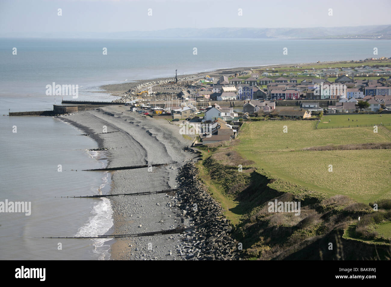 Town of Aberaeron, Wales. Distant aerial view of sea defences ...