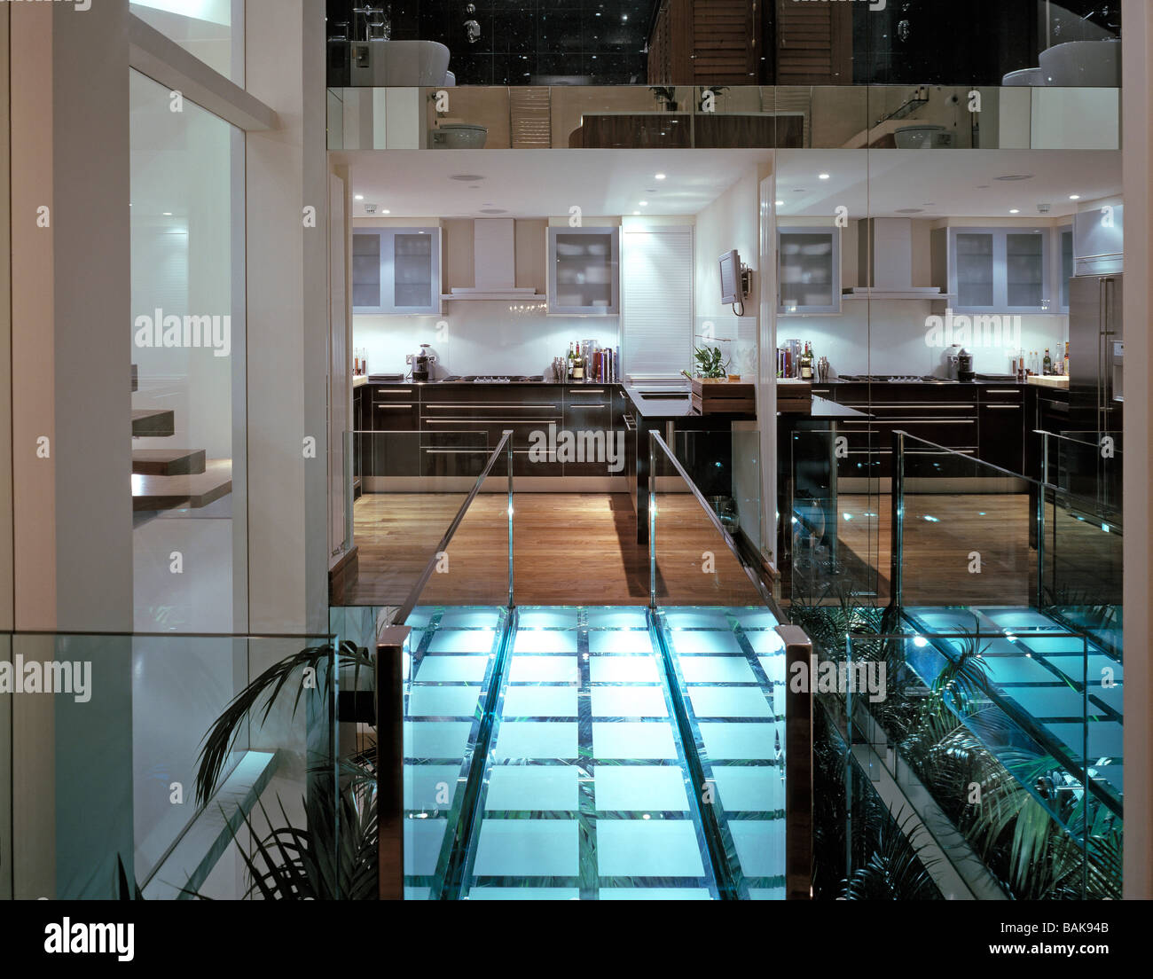 private house interior view - around glass bridge in atrium Stock Photo ...