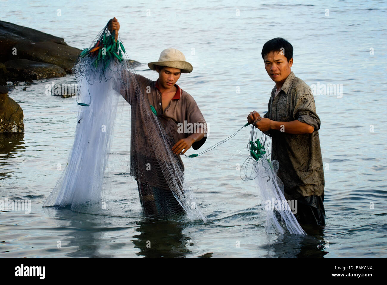 Fisherman on boat throwing rope hi-res stock photography and images - Alamy
