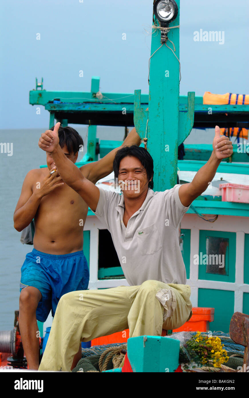 The fishermen on a fishing boat Stock Photo - Alamy