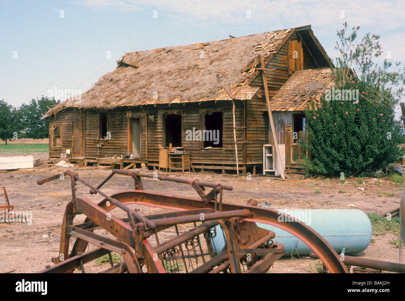 desert abandon farm ranch house weather worn old antique tool machine ...