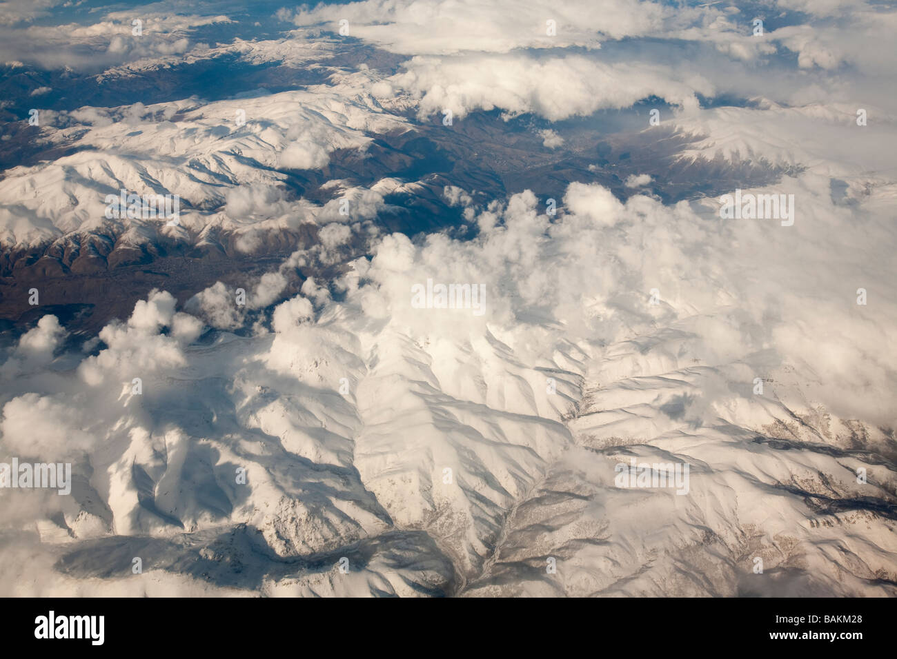 Flying over snow covered mountains in Iran Stock Photo - Alamy