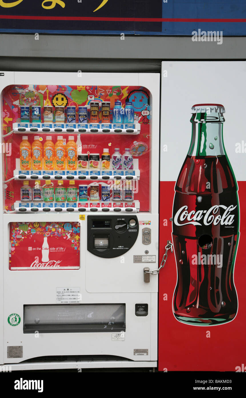 Busy life in the streets of Tokyo in the Shinjuku area, a coca cola ...