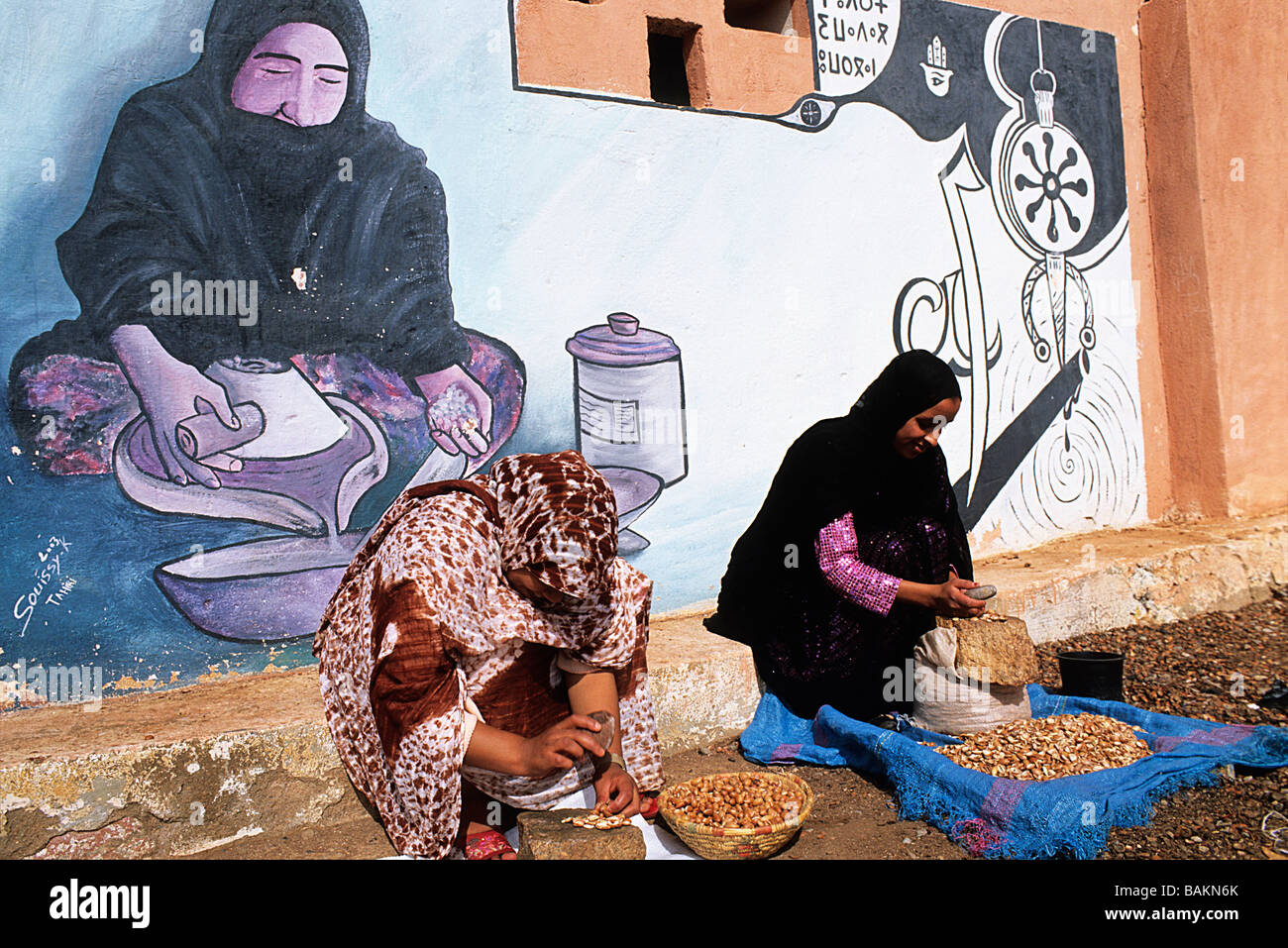 Morocco, Souss Massa Draa Region, Mesti, crushing argan skin Stock ...