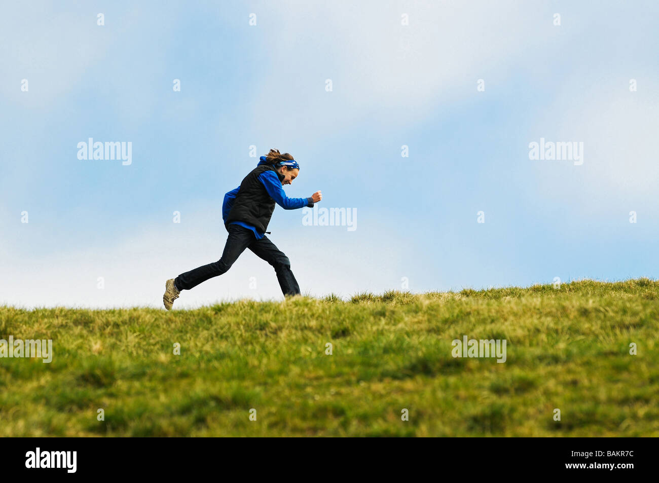 action image of girl running outdoors Stock Photo - Alamy