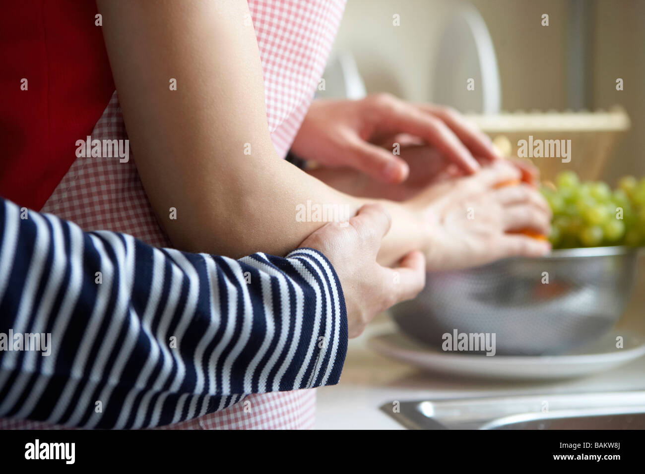 Two People Preparing Food Together Stock Photo - Alamy