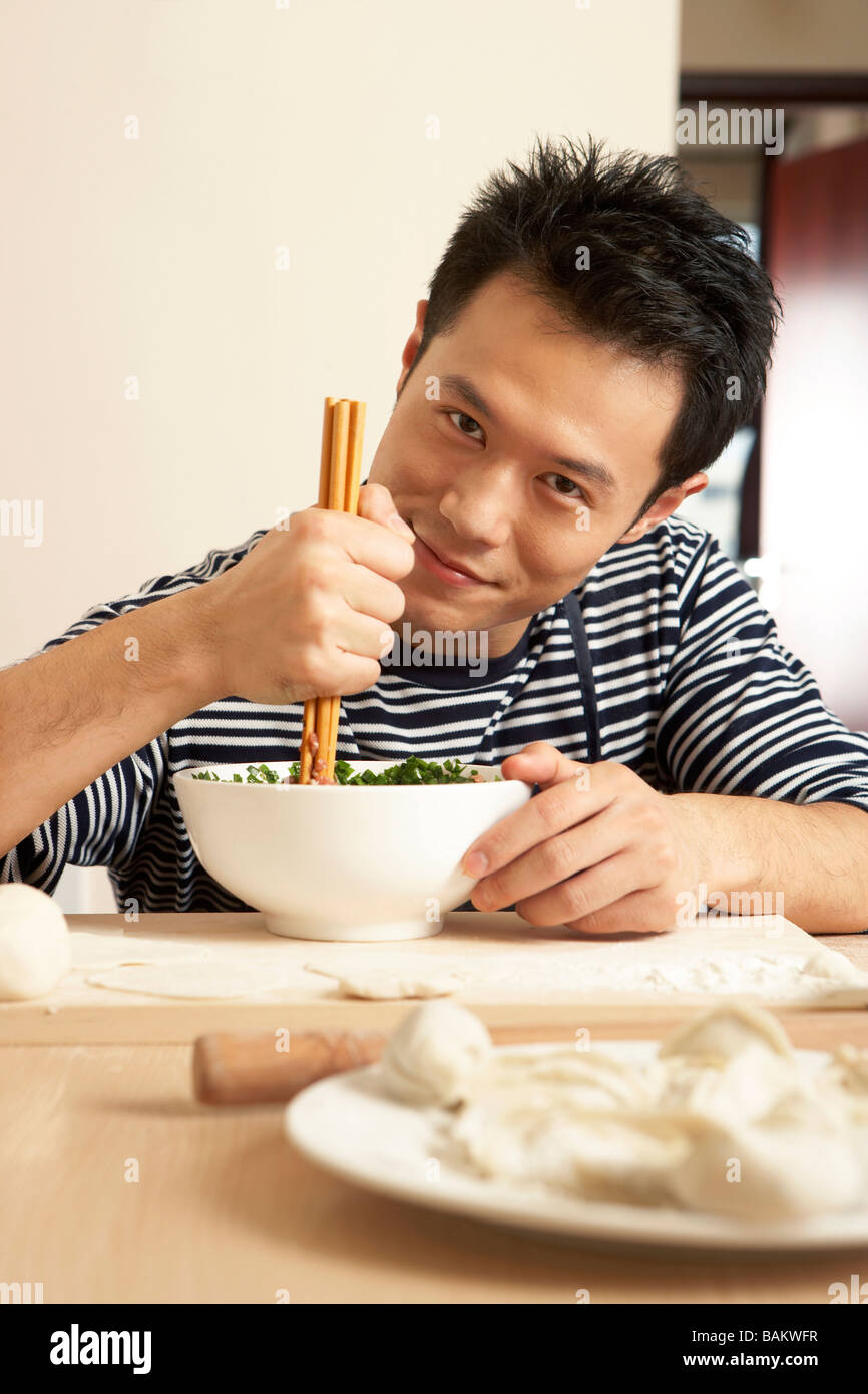 Front view asian guy cutting hi-res stock photography and images - Alamy