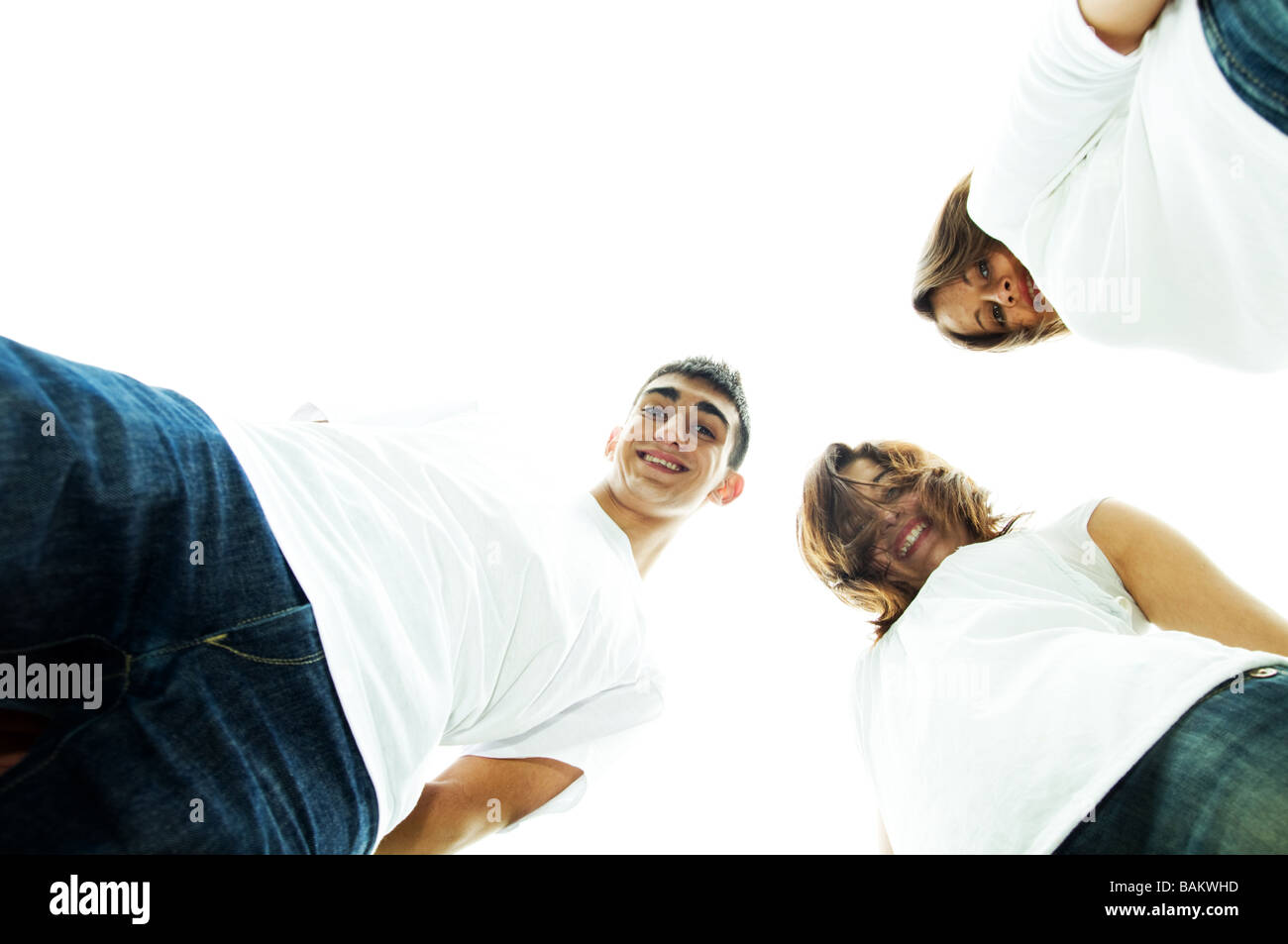 Team of friends standing together and smiling Stock Photo - Alamy