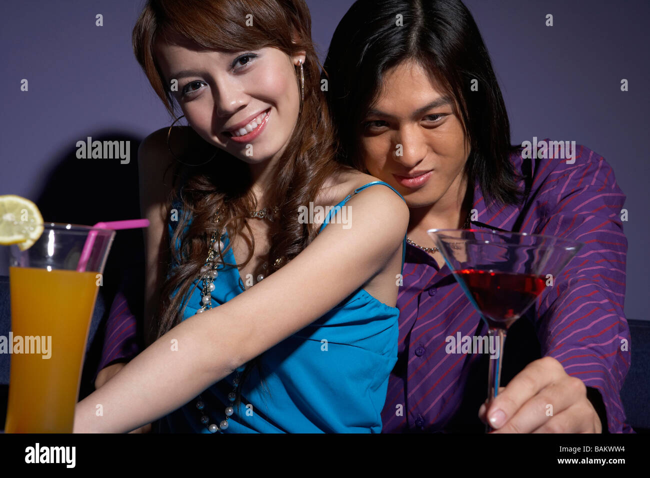 Couple Drinking In Bar Together Stock Photo - Alamy