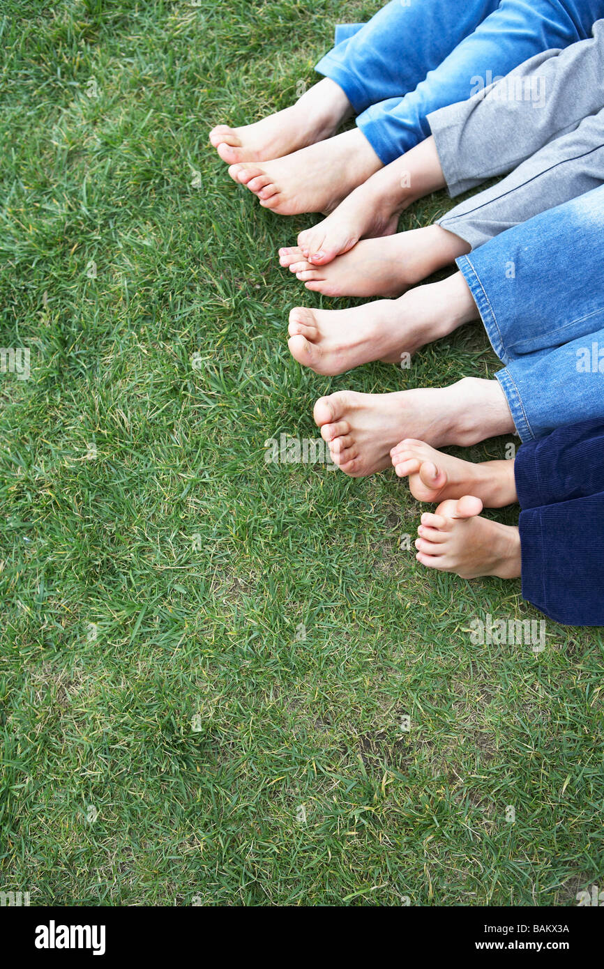 Feet Of People Lying Down In Park Stock Photo - Alamy