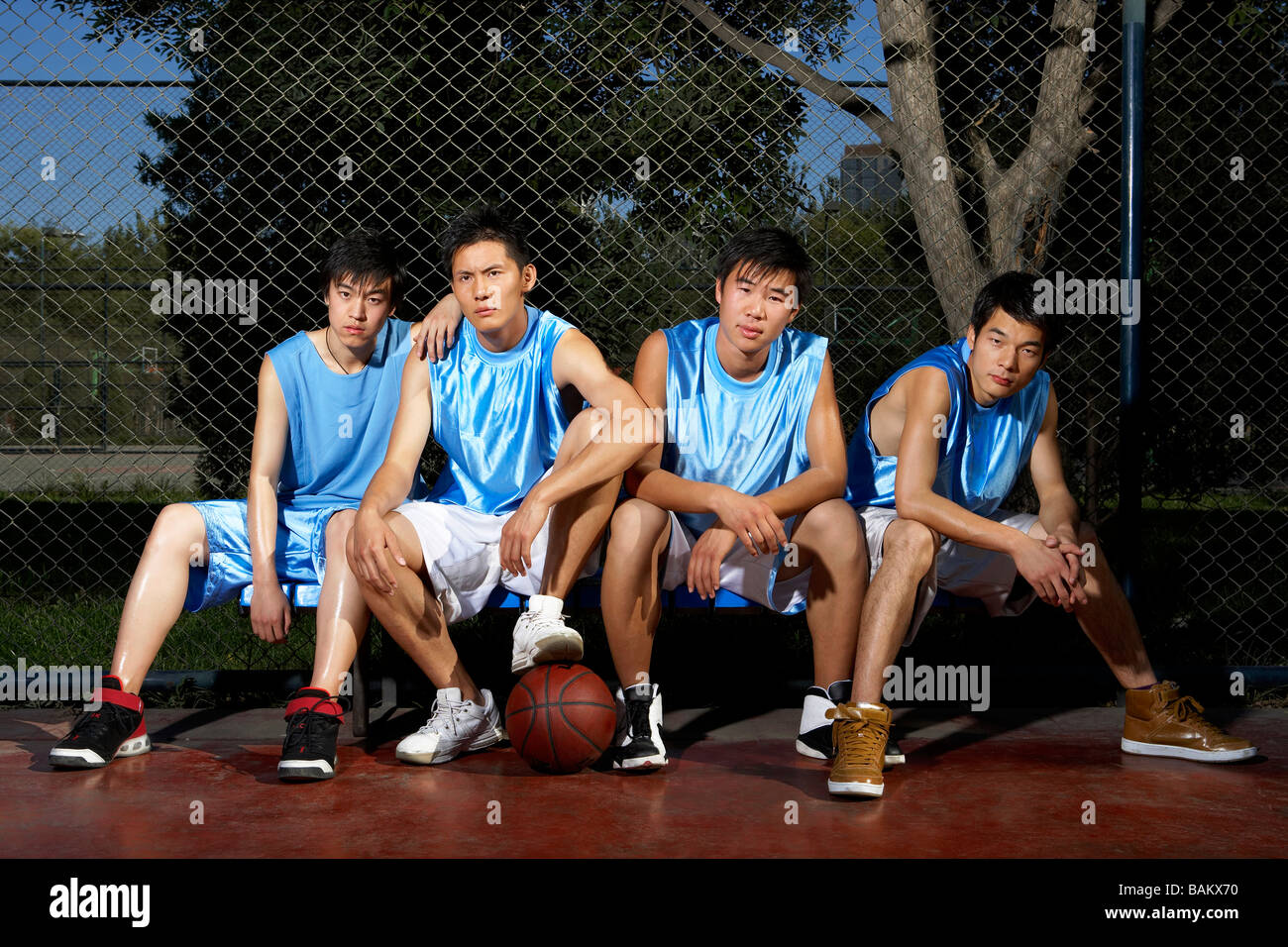 Portrait Of Young Men On A Basketball Court Stock Photo - Alamy