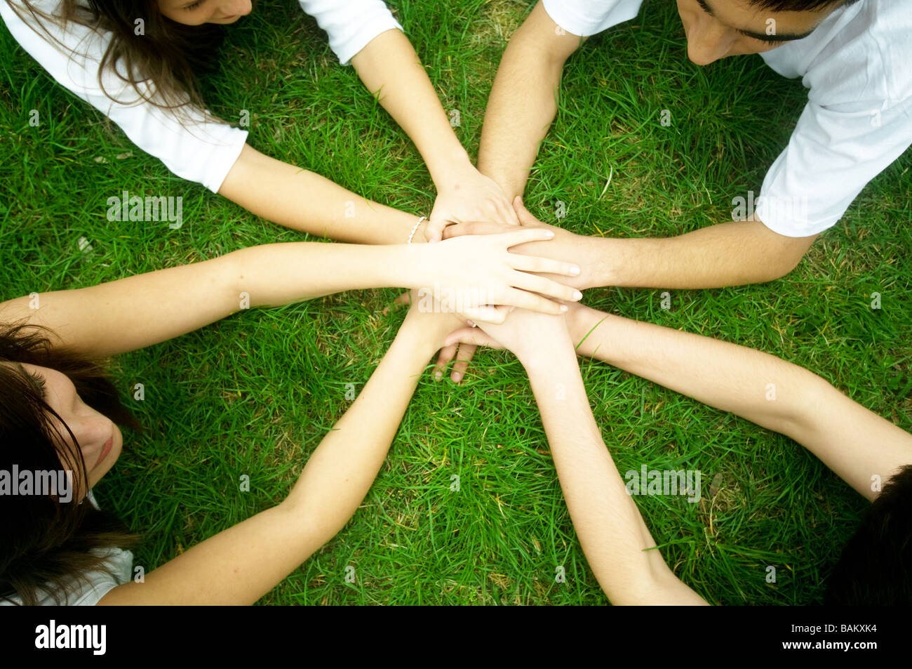 Group of friends joining hands. Unity, teamwork concept Stock Photo - Alamy
