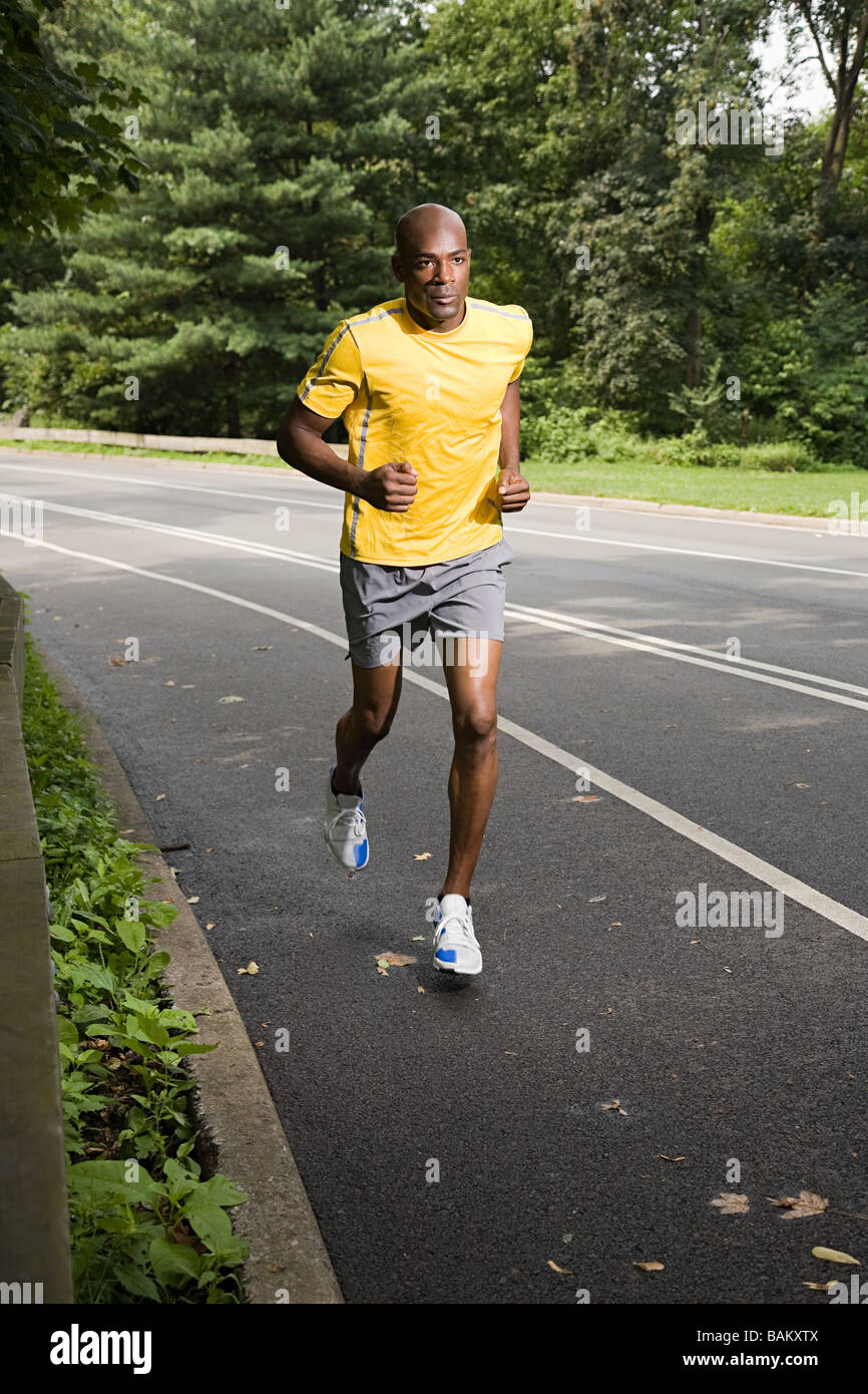 Runner on road Stock Photo - Alamy