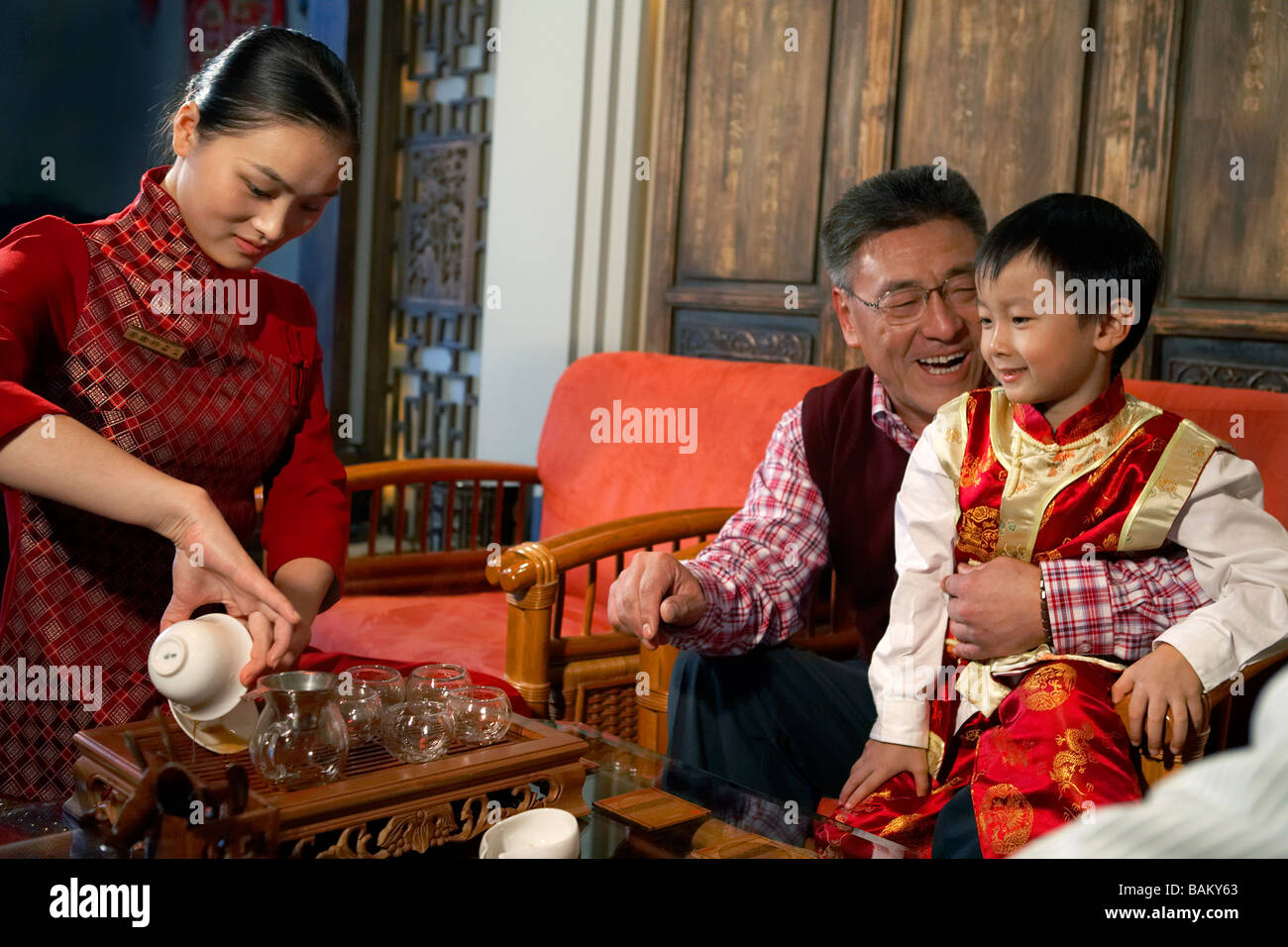 Family Having Tea Stock Photo - Alamy