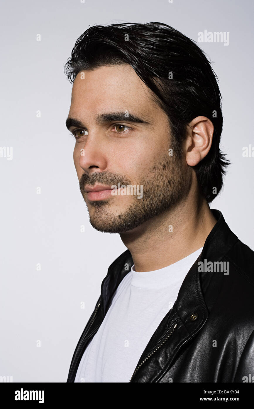 Profile of a young man wearing a leather jacket Stock Photo - Alamy