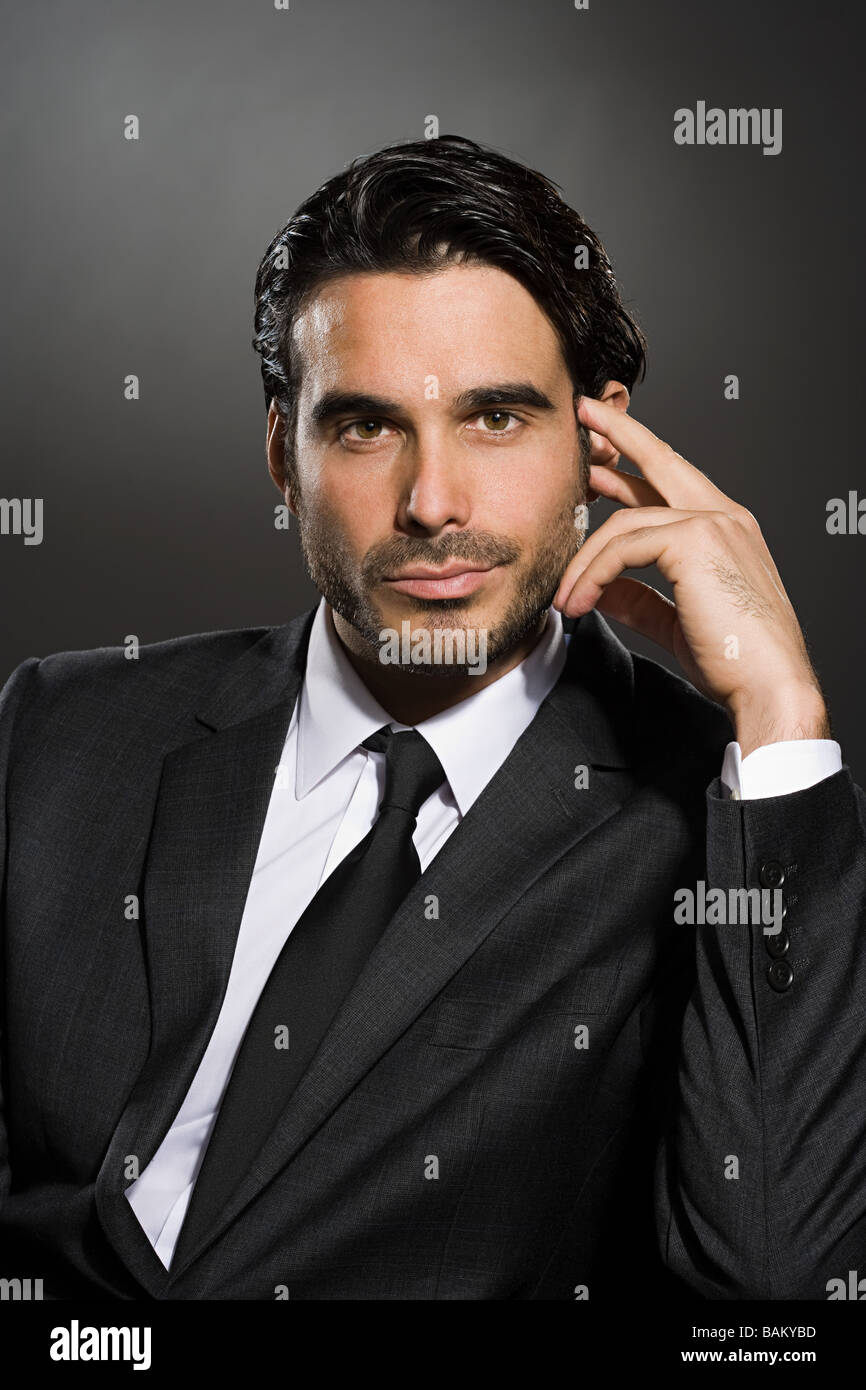 Profile of a young man wearing a suit Stock Photo - Alamy
