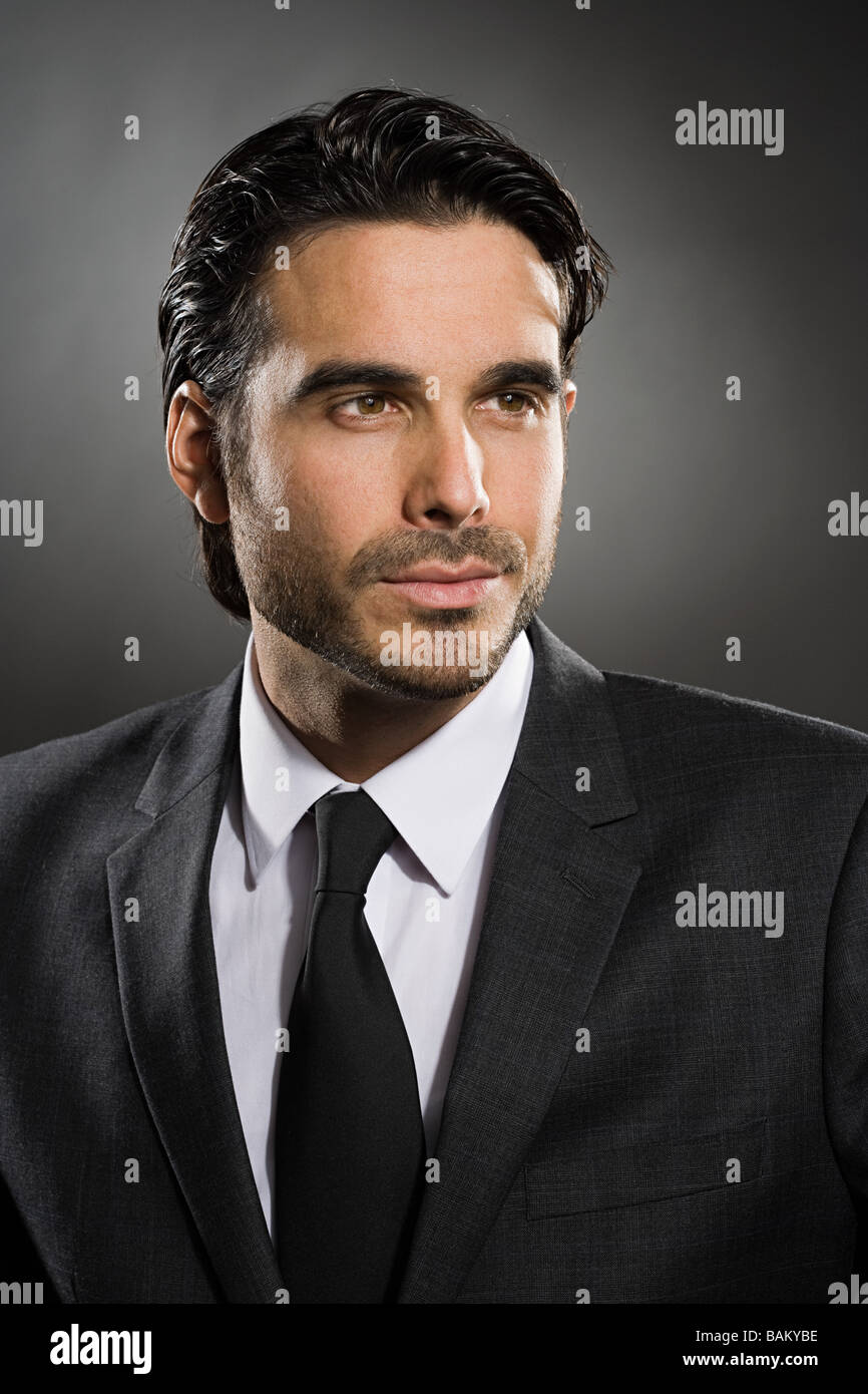 Profile of a young man wearing a suit Stock Photo - Alamy