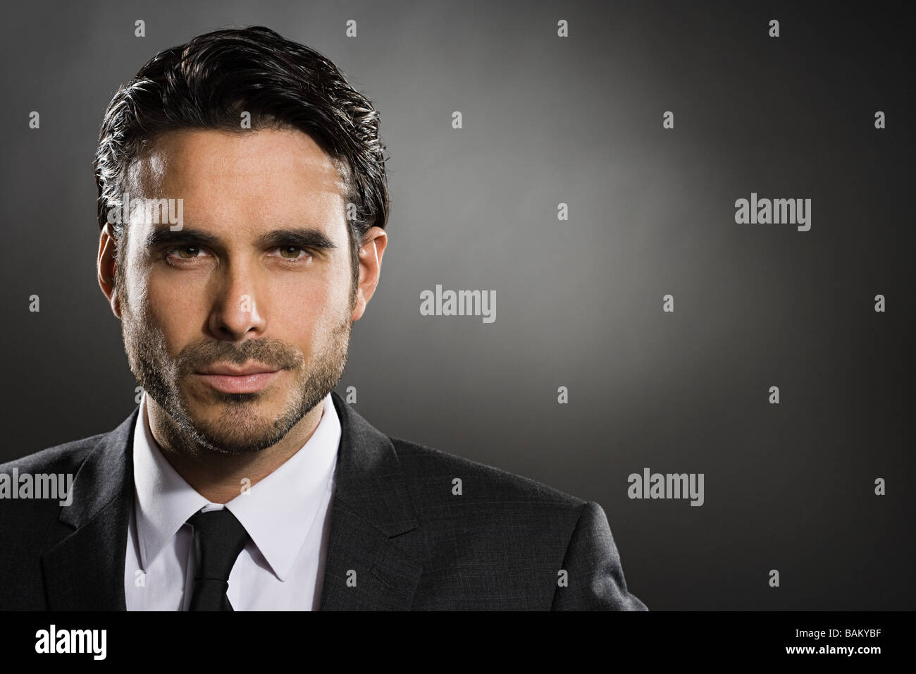 Profile of a young man wearing a suit Stock Photo - Alamy