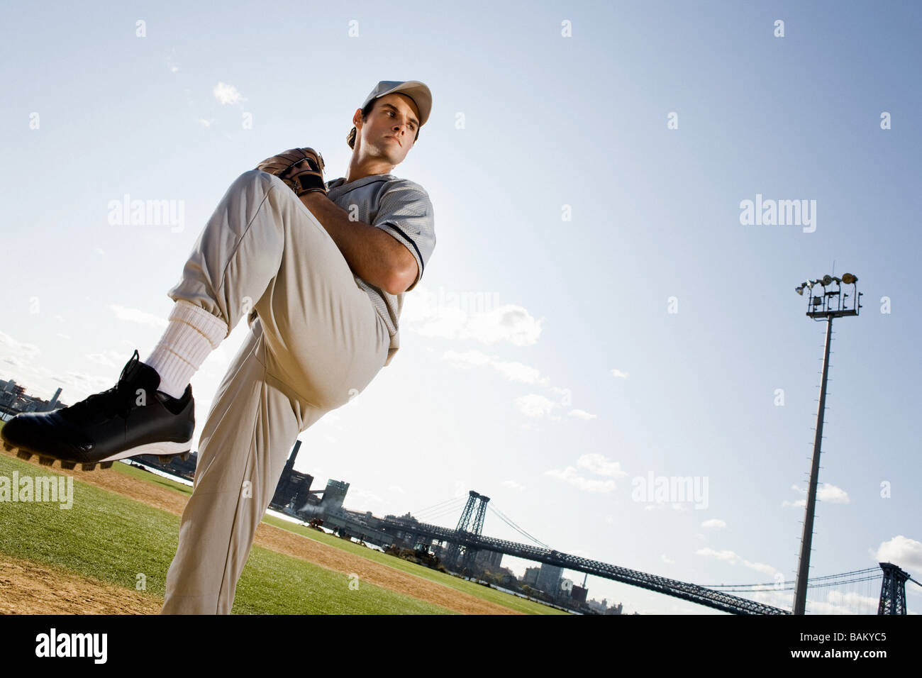 Baseball pitcher standing on one leg Stock Photo - Alamy