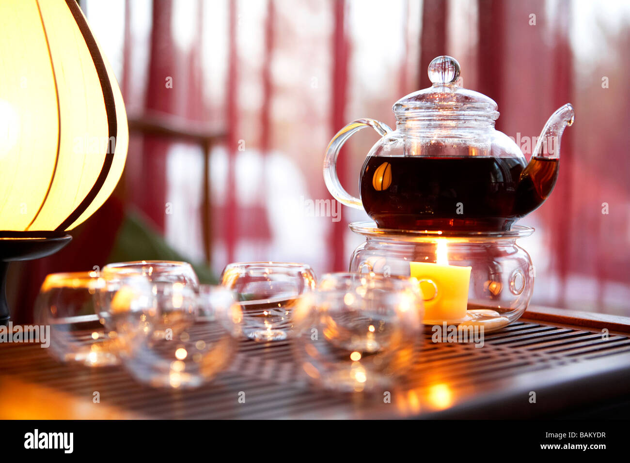 Tea Pot And Candle On Table Stock Photo - Alamy