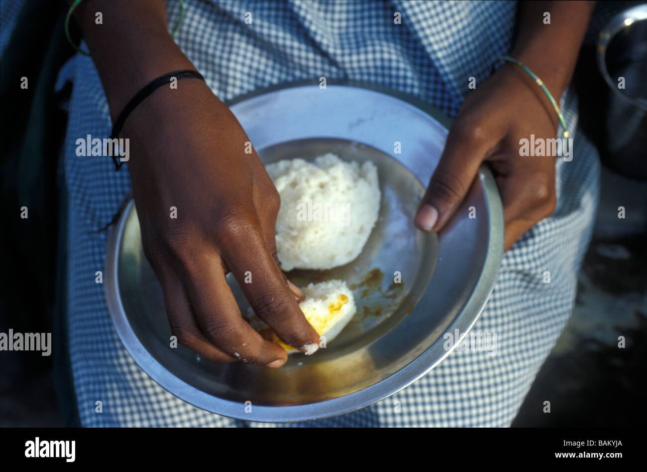 Indian child eating rice hi-res stock photography and images - Alamy