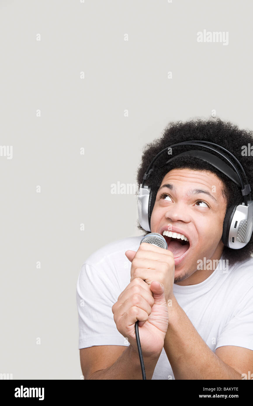 A young man singing Stock Photo - Alamy