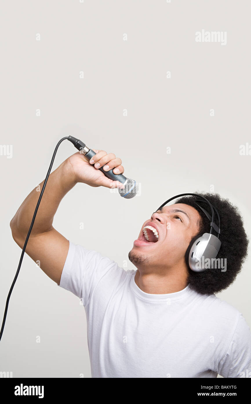 A young man singing Stock Photo - Alamy