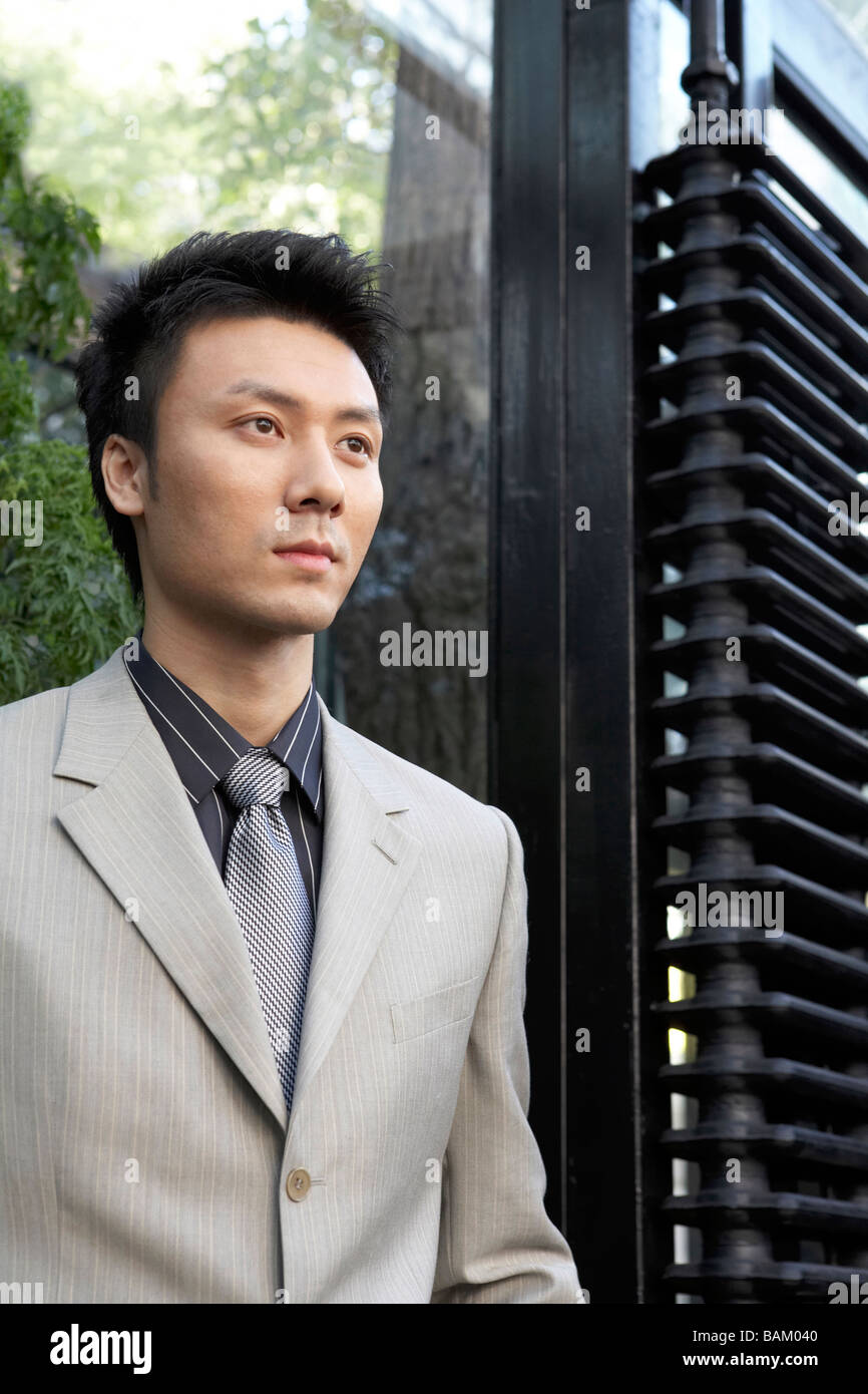 Businessman Standing Outside A Building Stock Photo - Alamy