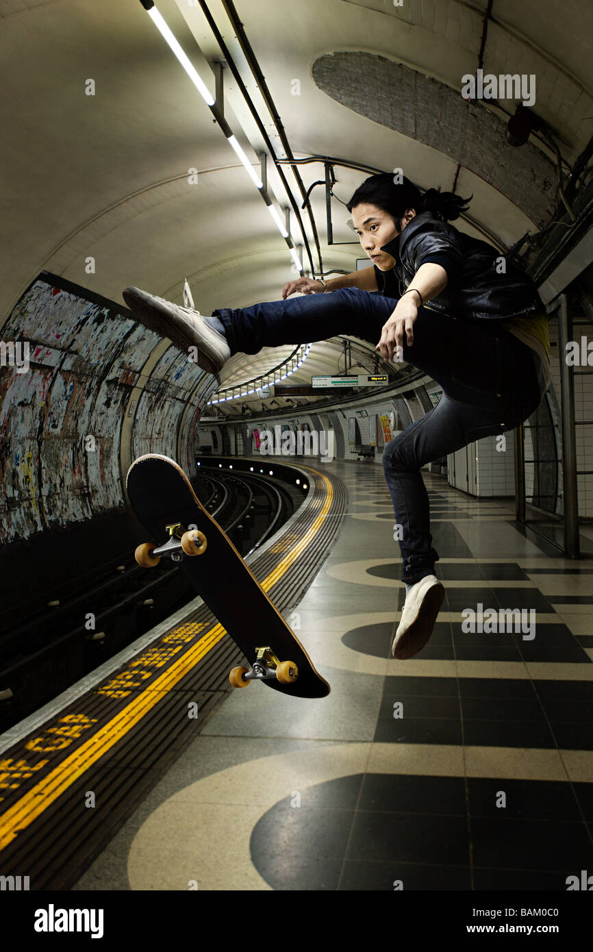 A young man skateboarding Stock Photo - Alamy