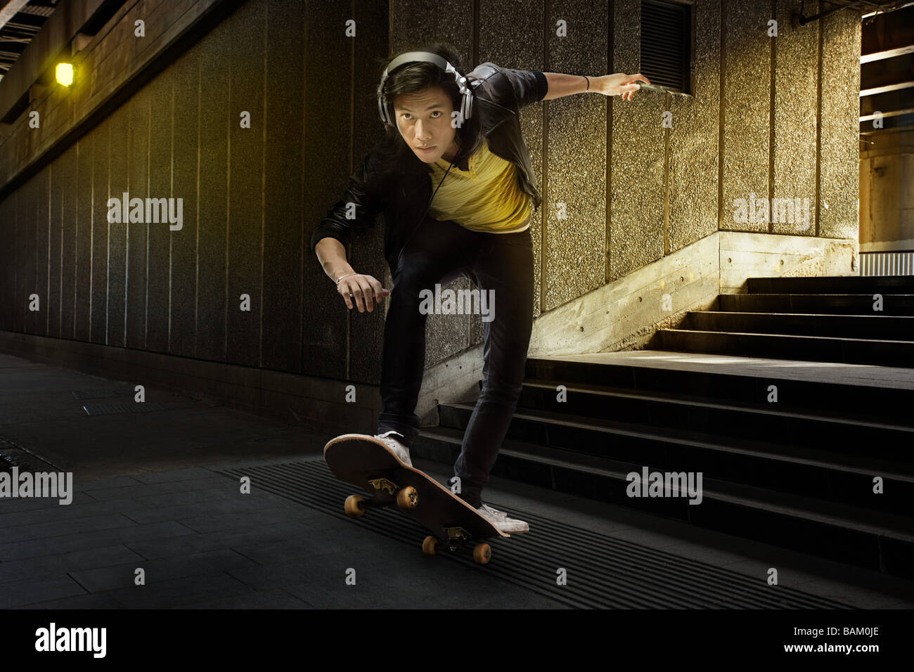 A young man skateboarding Stock Photo - Alamy