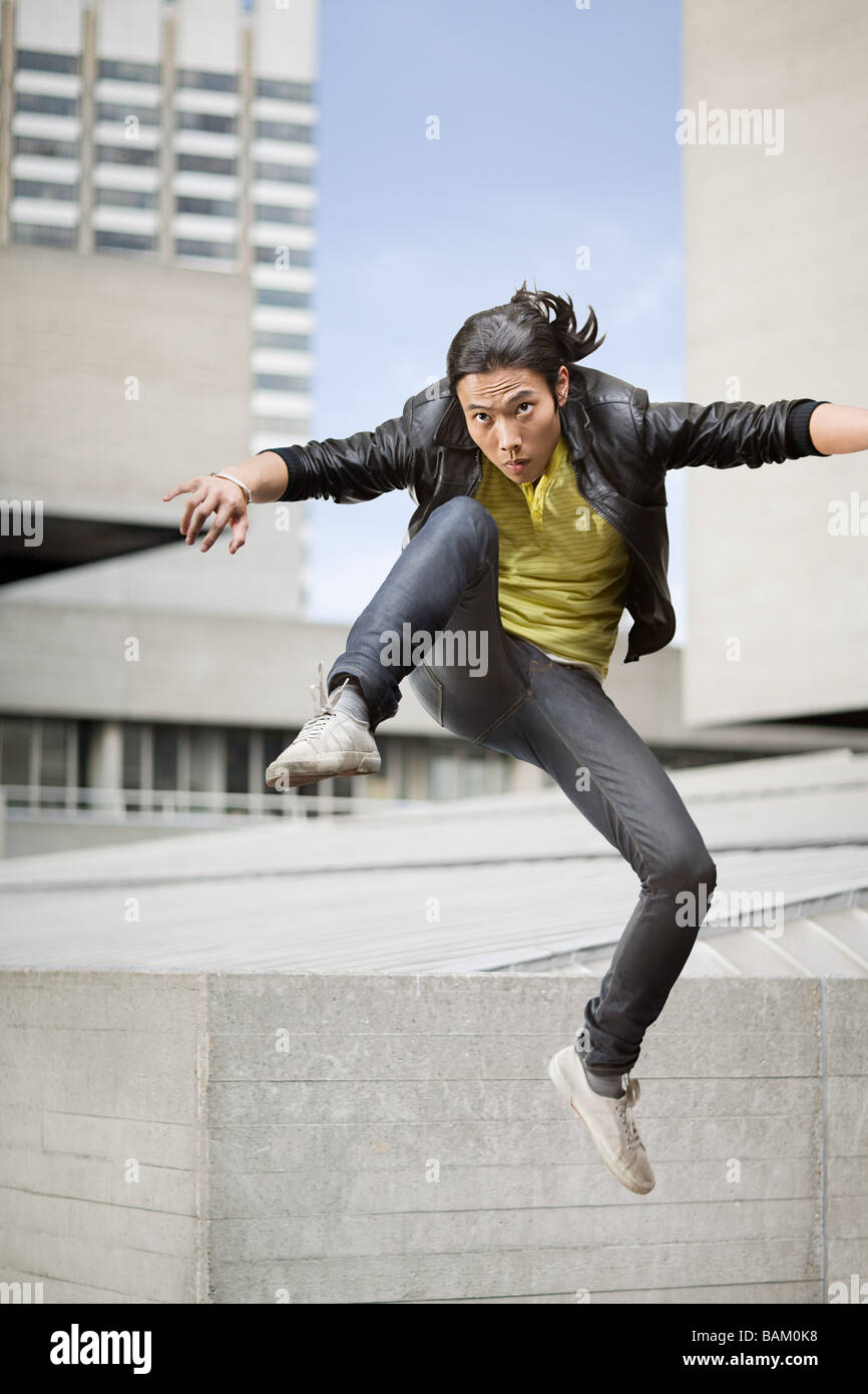 A young man kicking Stock Photo - Alamy