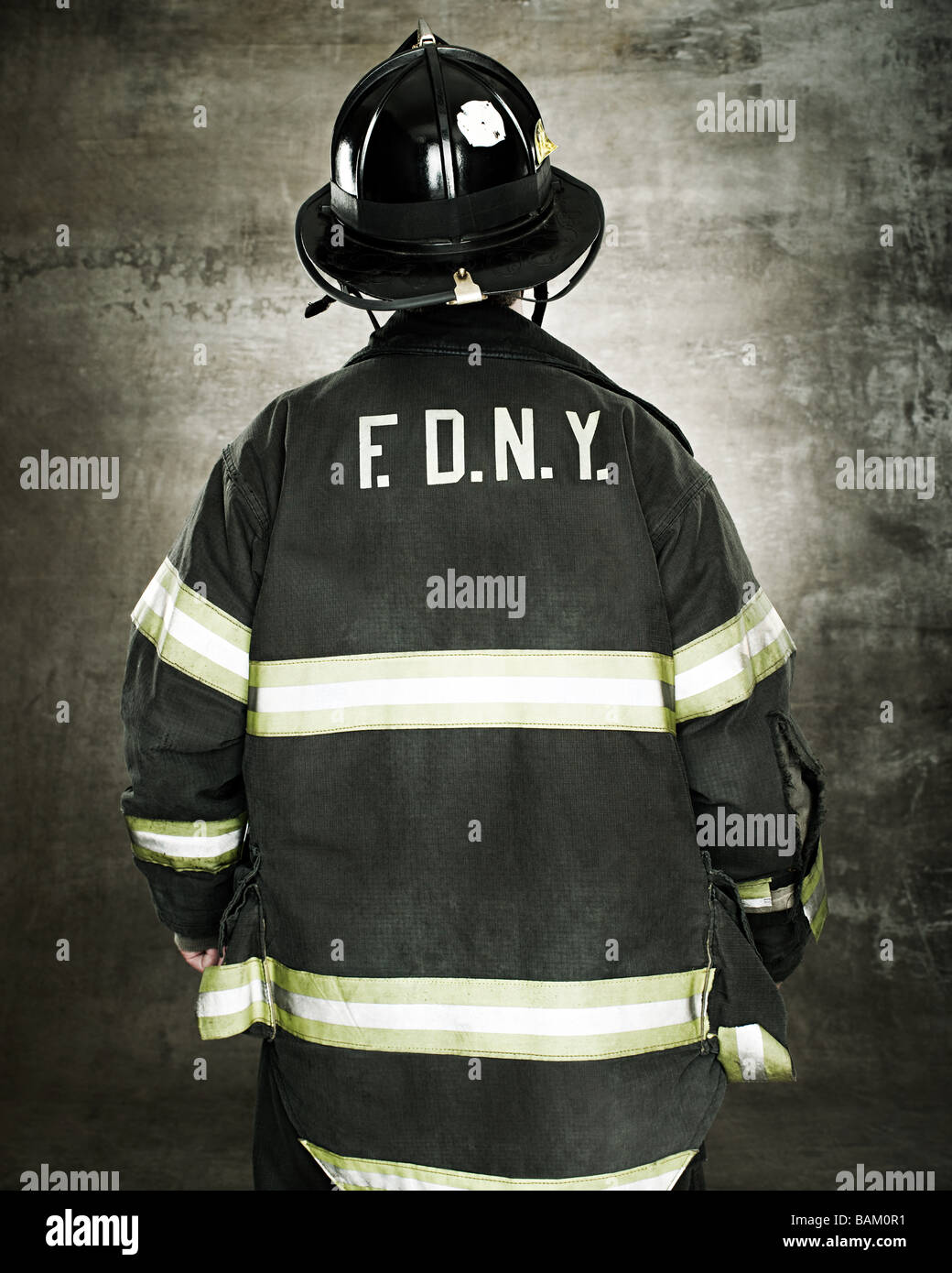 Rear view of a firefighter Stock Photo - Alamy