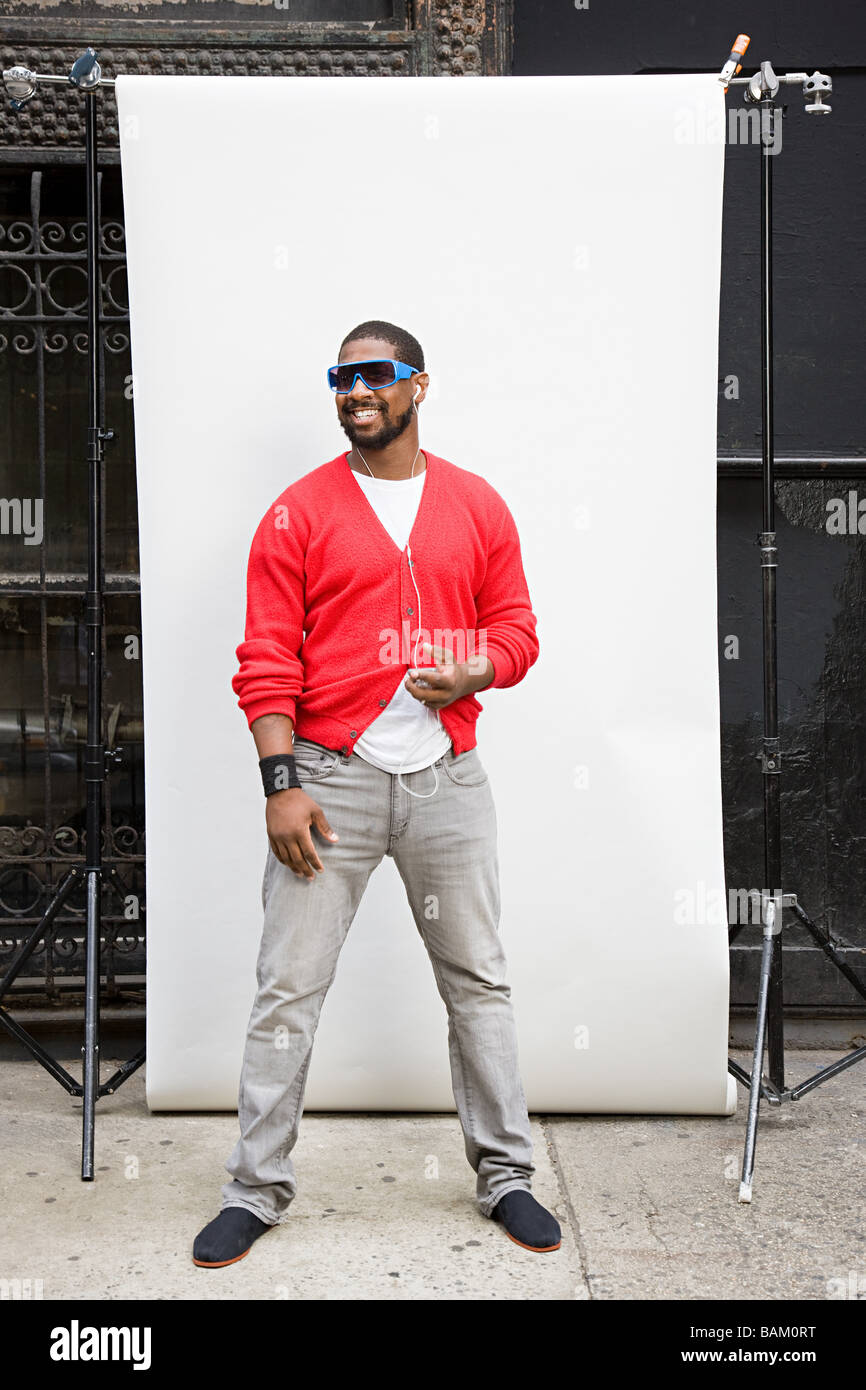 Man in front of backdrop Stock Photo - Alamy
