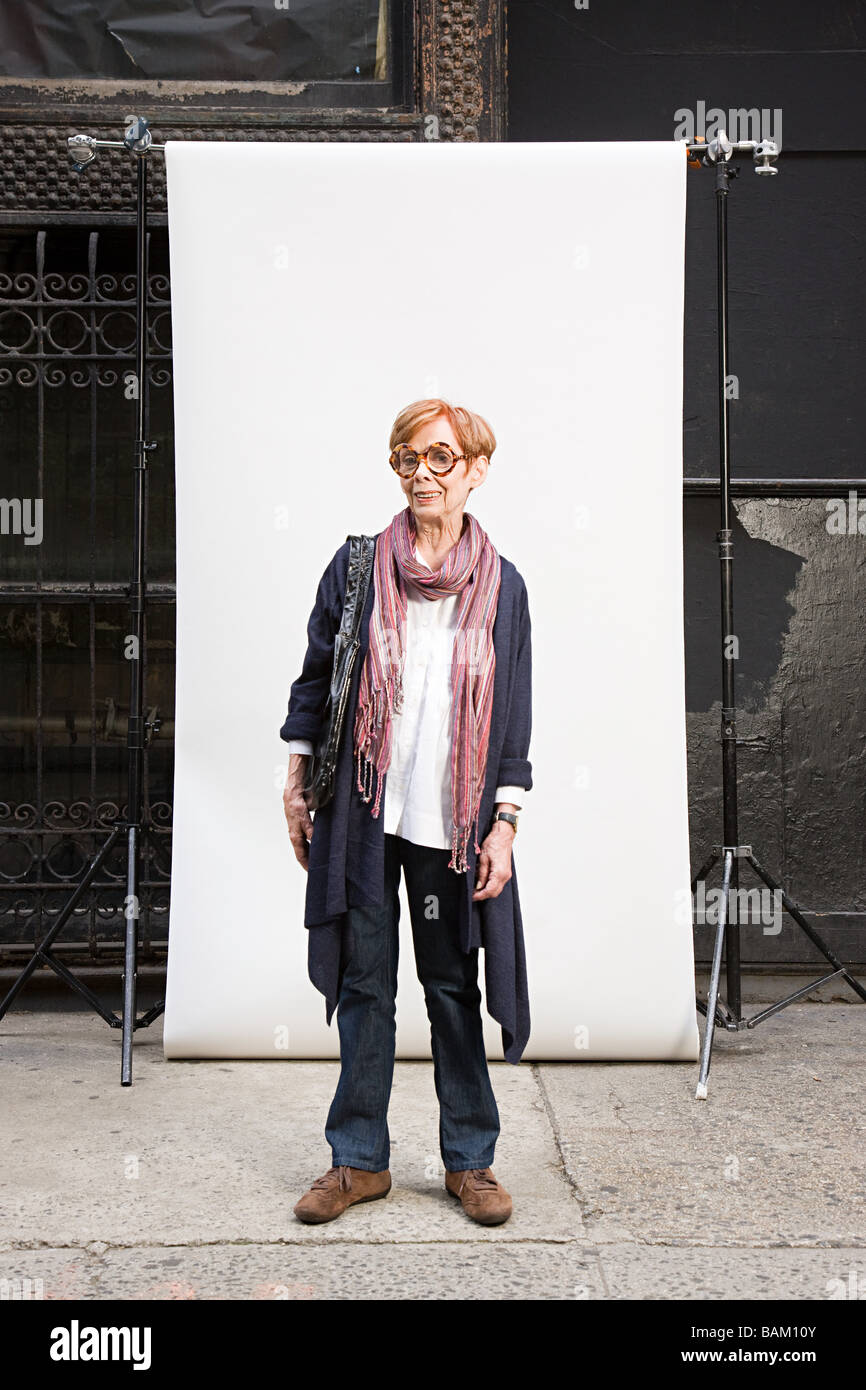 Woman standing in front of city backdrop hi-res stock photography and ...