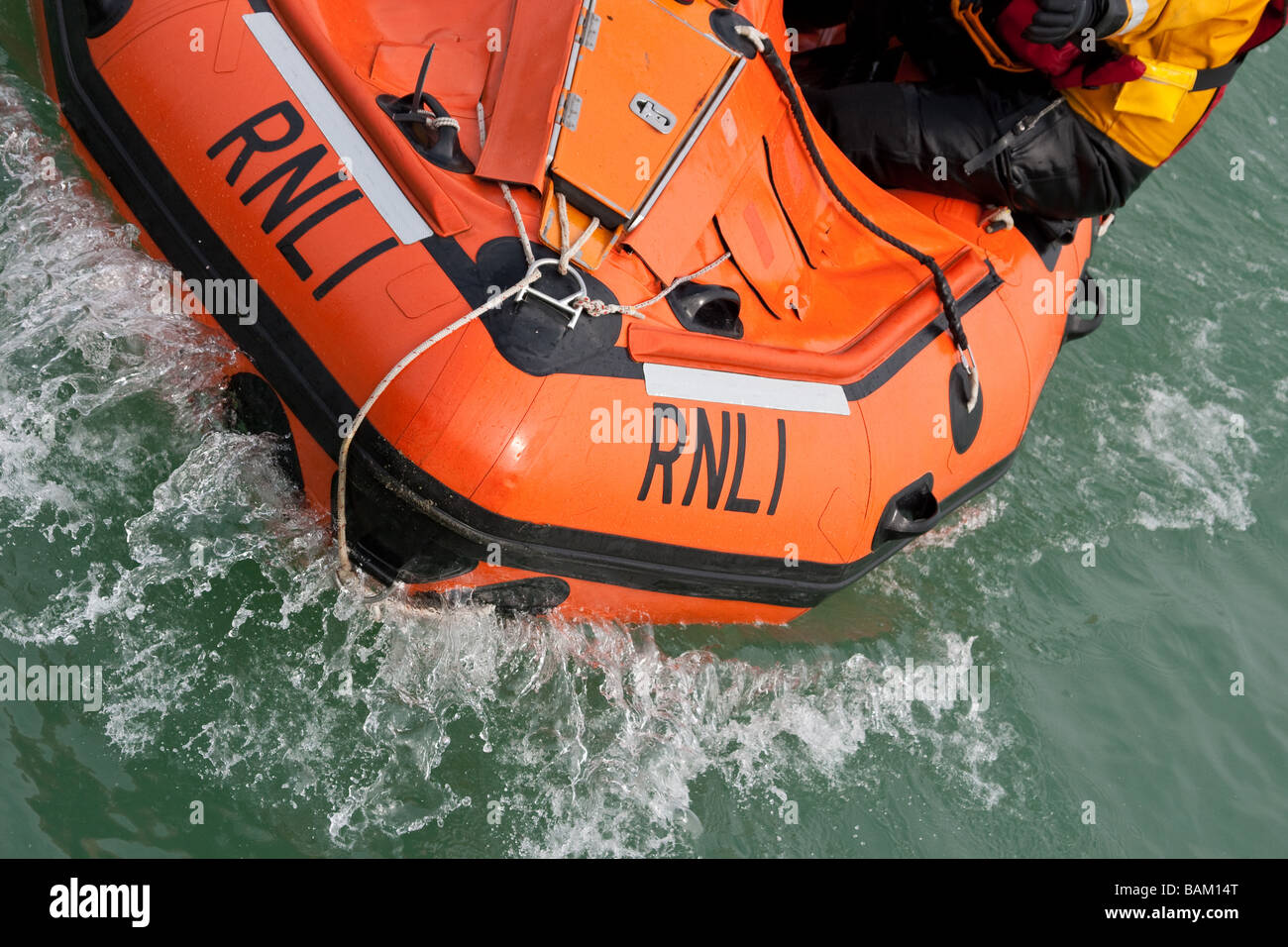 RNLI (Royal National Lifeboat Institution) crew members in a boat ...