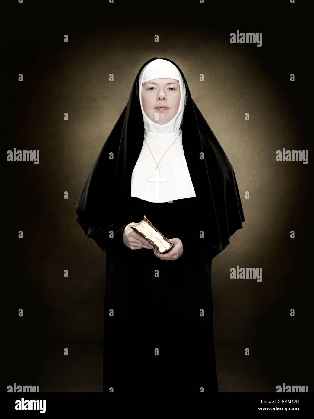 Portrait of a nun holding a bible Stock Photo - Alamy