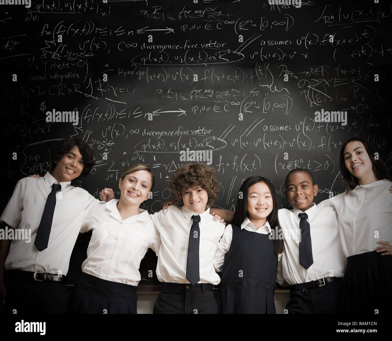 Students in front of blackboard Stock Photo - Alamy