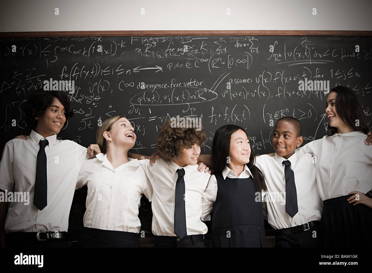 Students in front of blackboard Stock Photo - Alamy