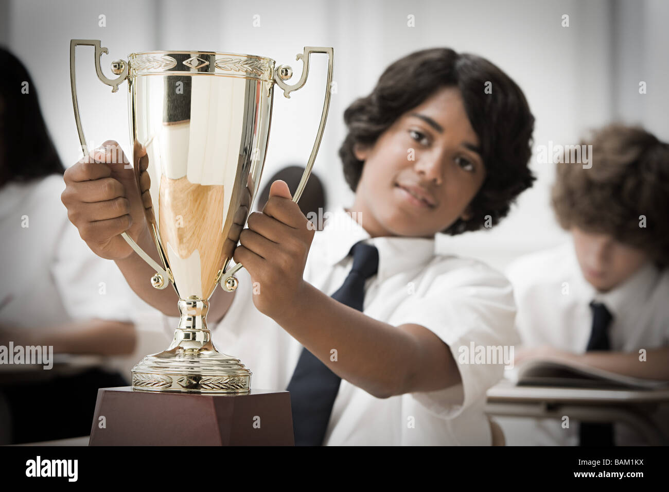 Boy with trophy Stock Photo - Alamy