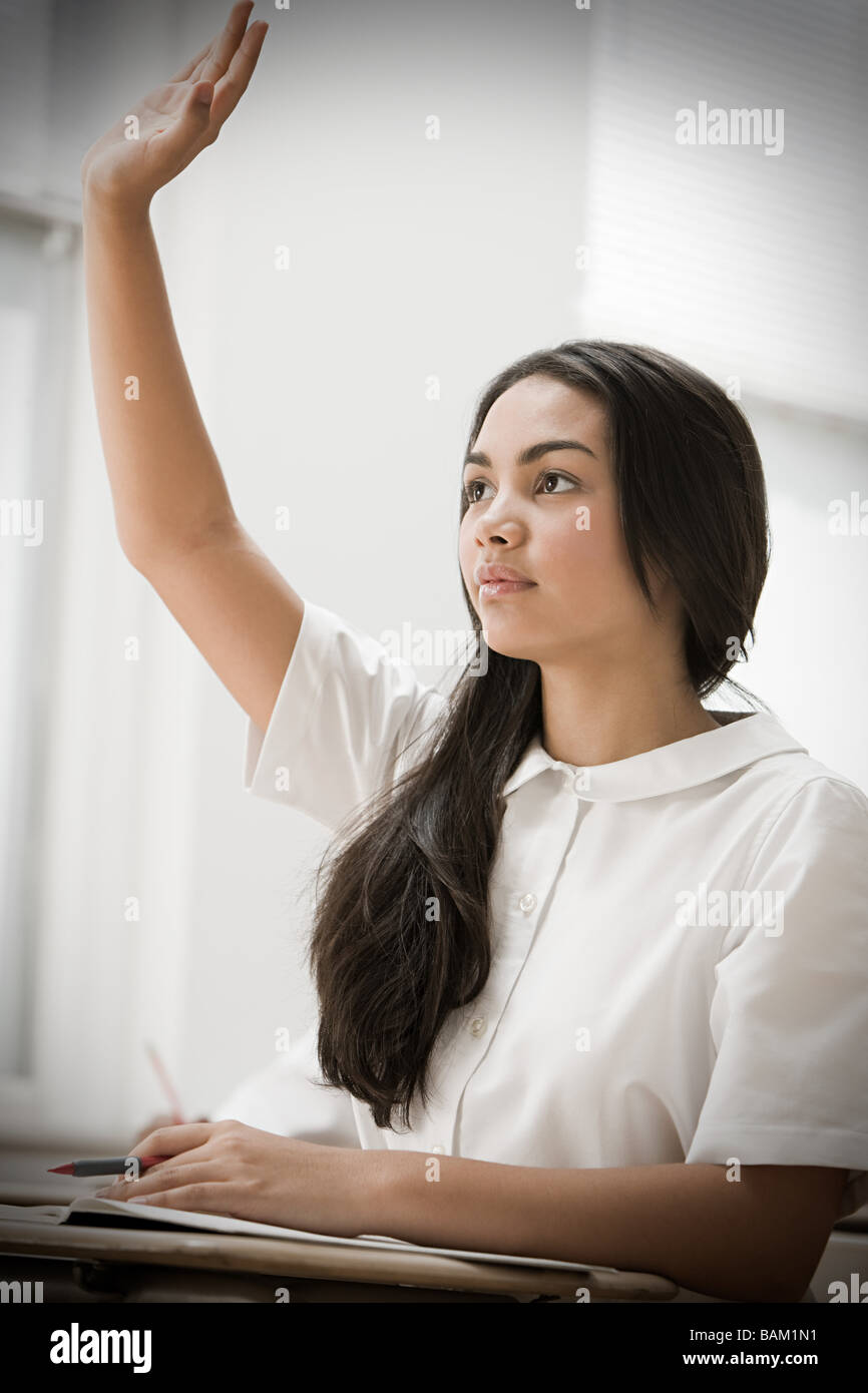Girl with hands raised Stock Photo - Alamy