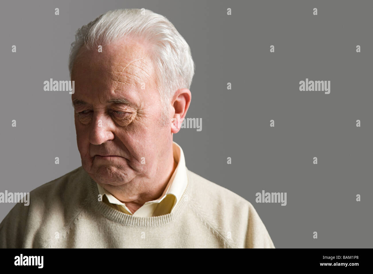 Senior man looking upset Stock Photo - Alamy