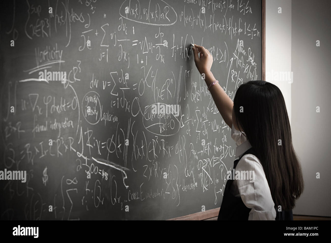 School girl 10 13 writing blackboard hi-res stock photography and ...
